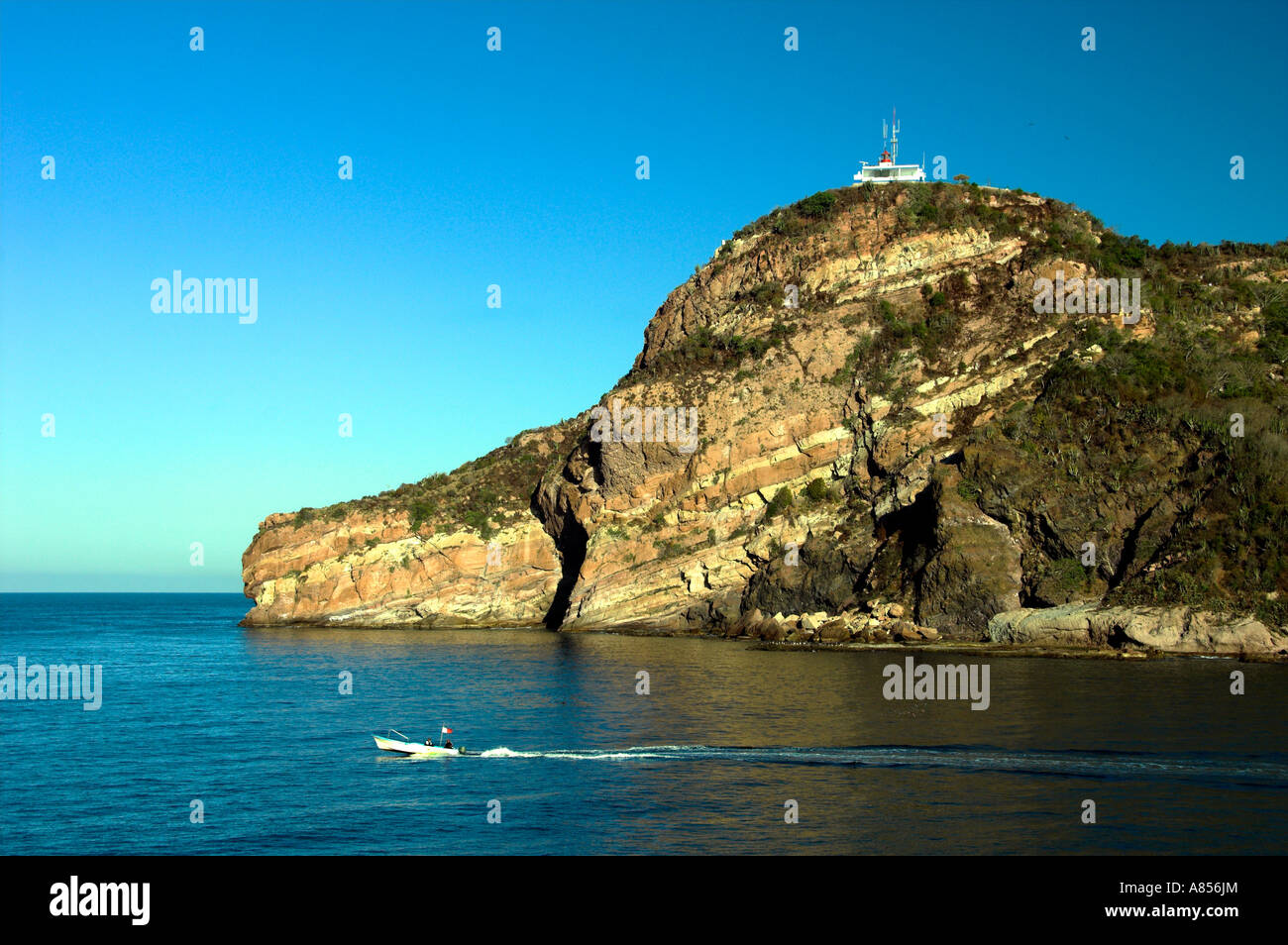 The lighthouse on a hill at the entrance to the port of Mazatlan Mexico ...