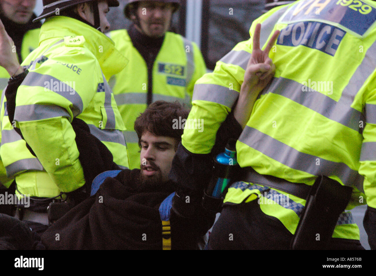 Police arrest a peace demonstrator at the gates of the Northwood ...