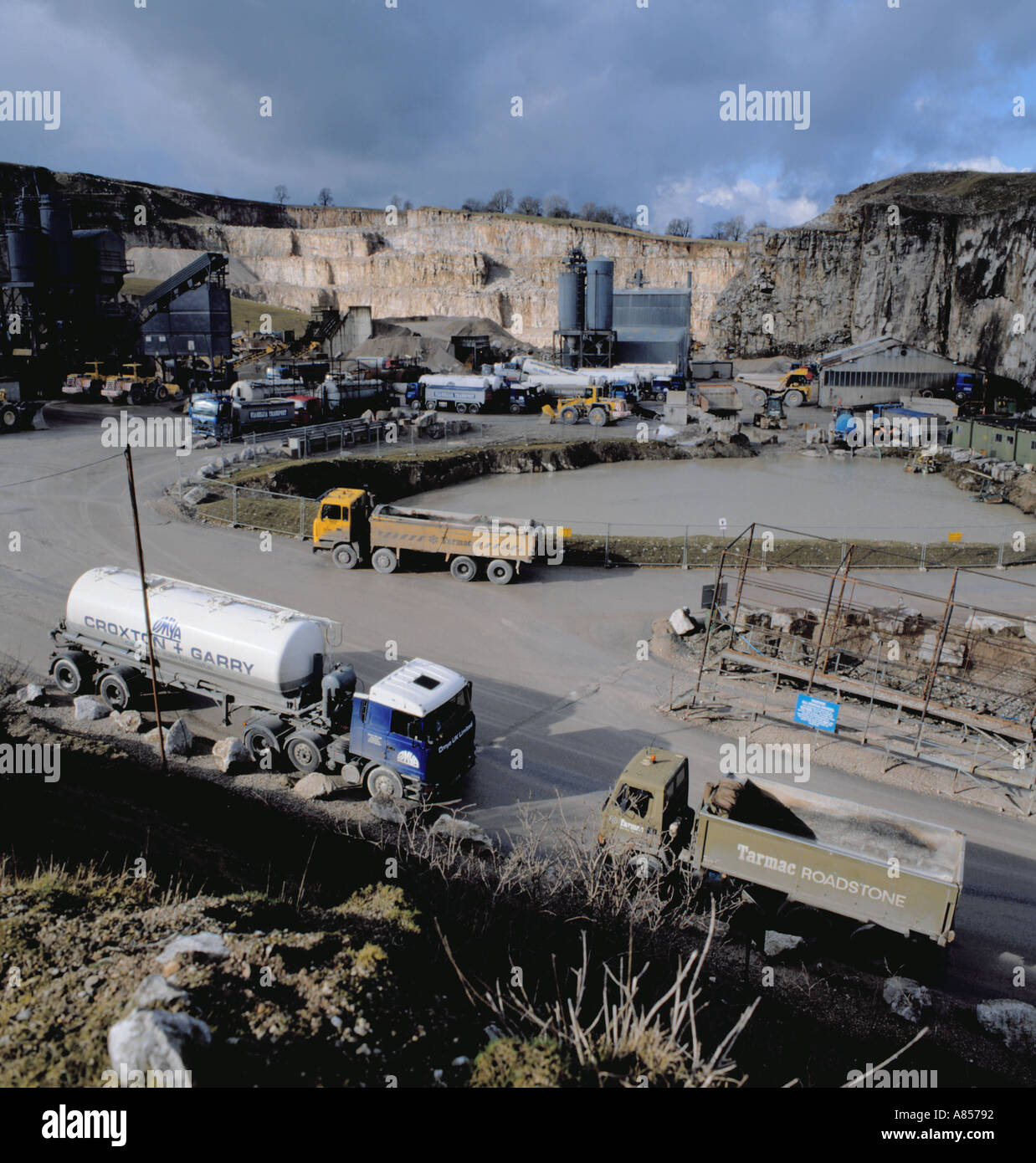 General view of a limestone quarry over settling lagoons, near Cromford ...