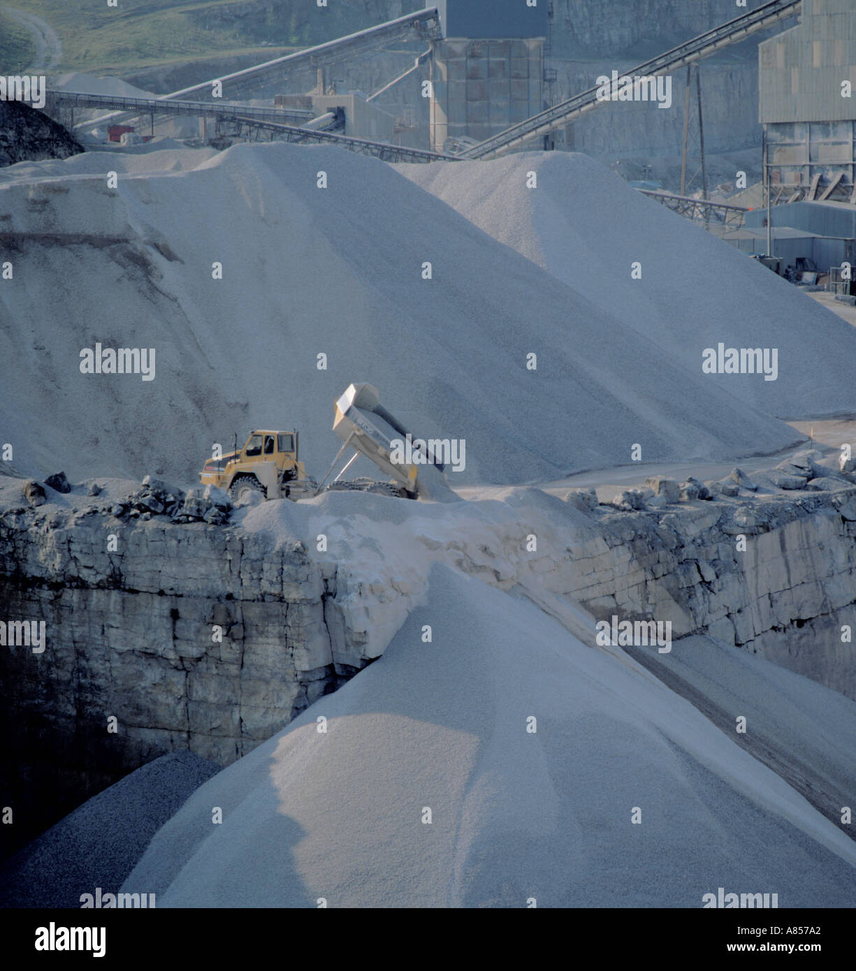 Dumper truck in the stockpile area in a limestone quarry, near Cromford ...