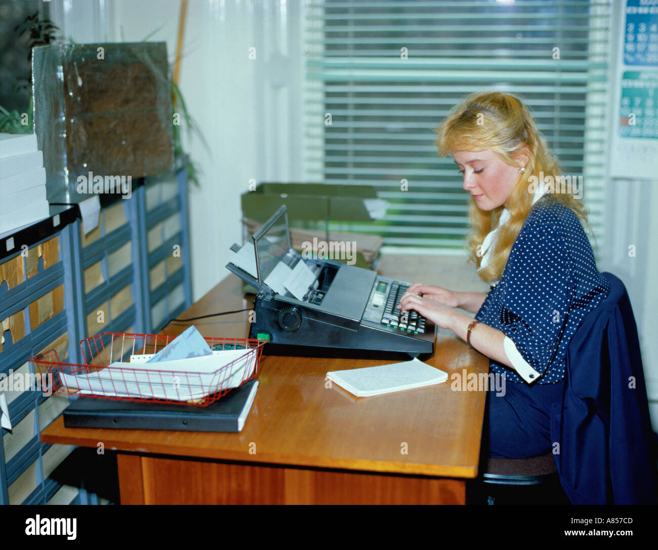 Secretary using an electric typewriter Stock Photo - Alamy