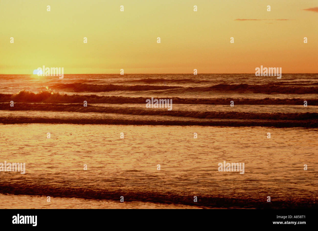 Sunrise light over gentle waves hi-res stock photography and images - Alamy