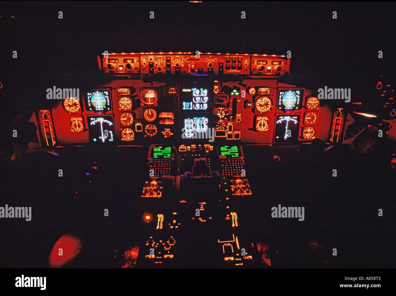 Flight deck simulator of Boeing 767 passenger jet aircraft. Night view ...