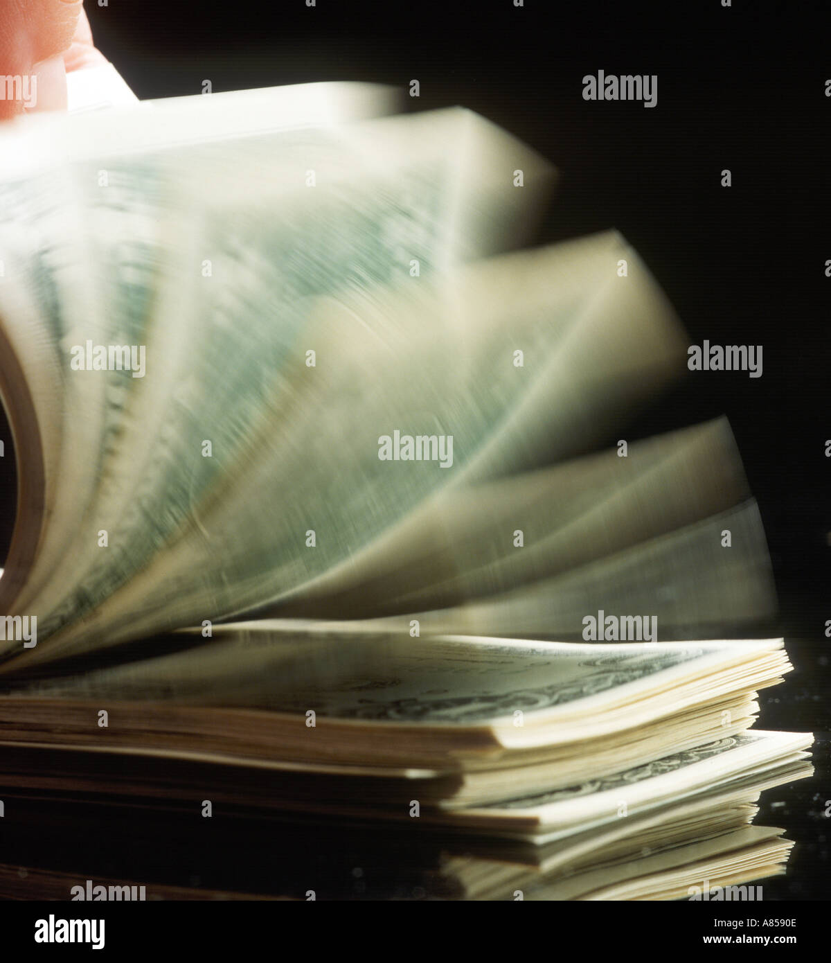 hand flipping through a stack of dollar bills US Stock Photo - Alamy