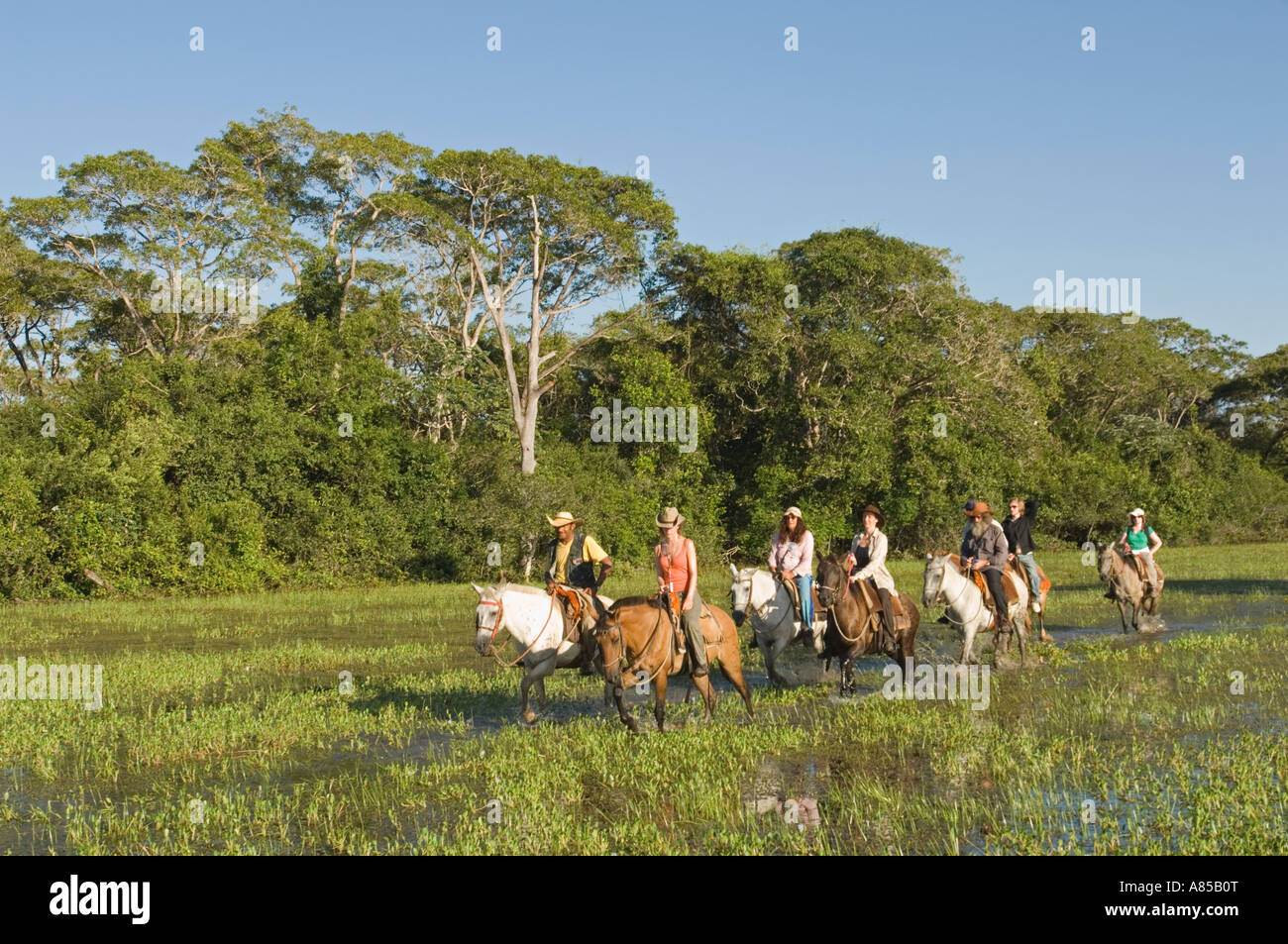 A group of european tourists on a guided horse riding trek through the ...