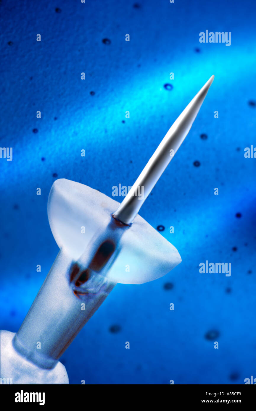 Sharp push pin pointing upwards Stock Photo - Alamy