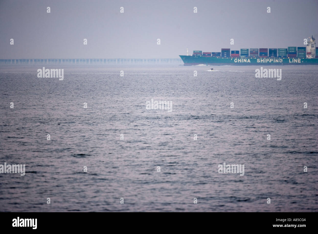 Container ship entering Chesapeake Bay at dusk Virginia Beach VA Stock ...