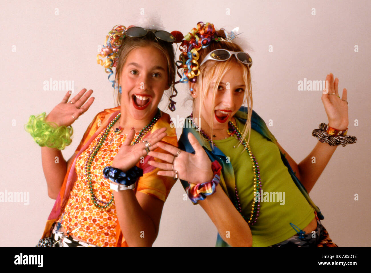 Teenage girls expressive faces dressed up as hippies Stock Photo - Alamy
