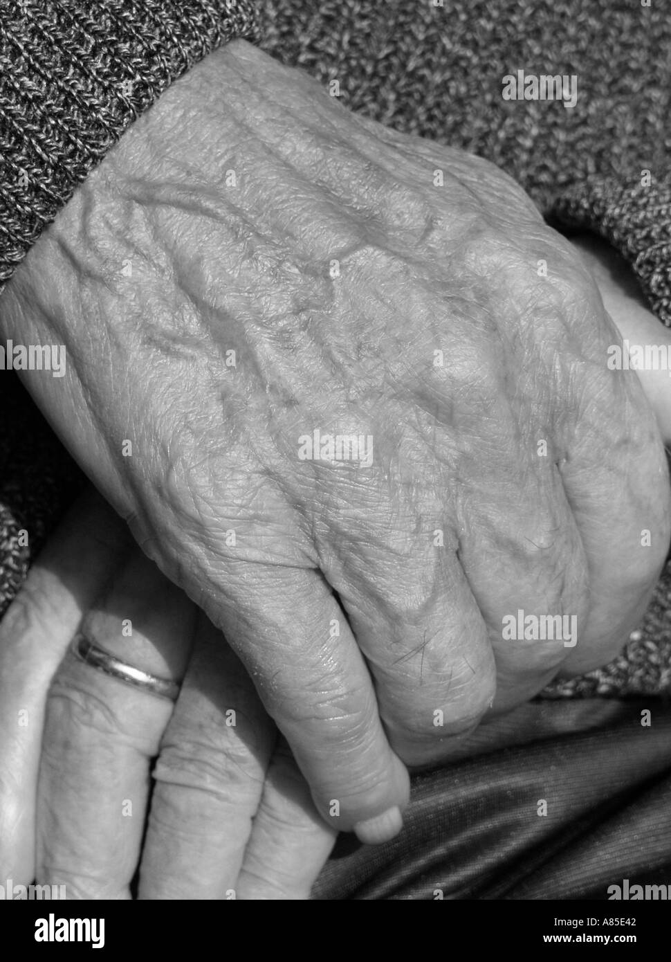 Hands old men women Black and White Stock Photos & Images - Alamy