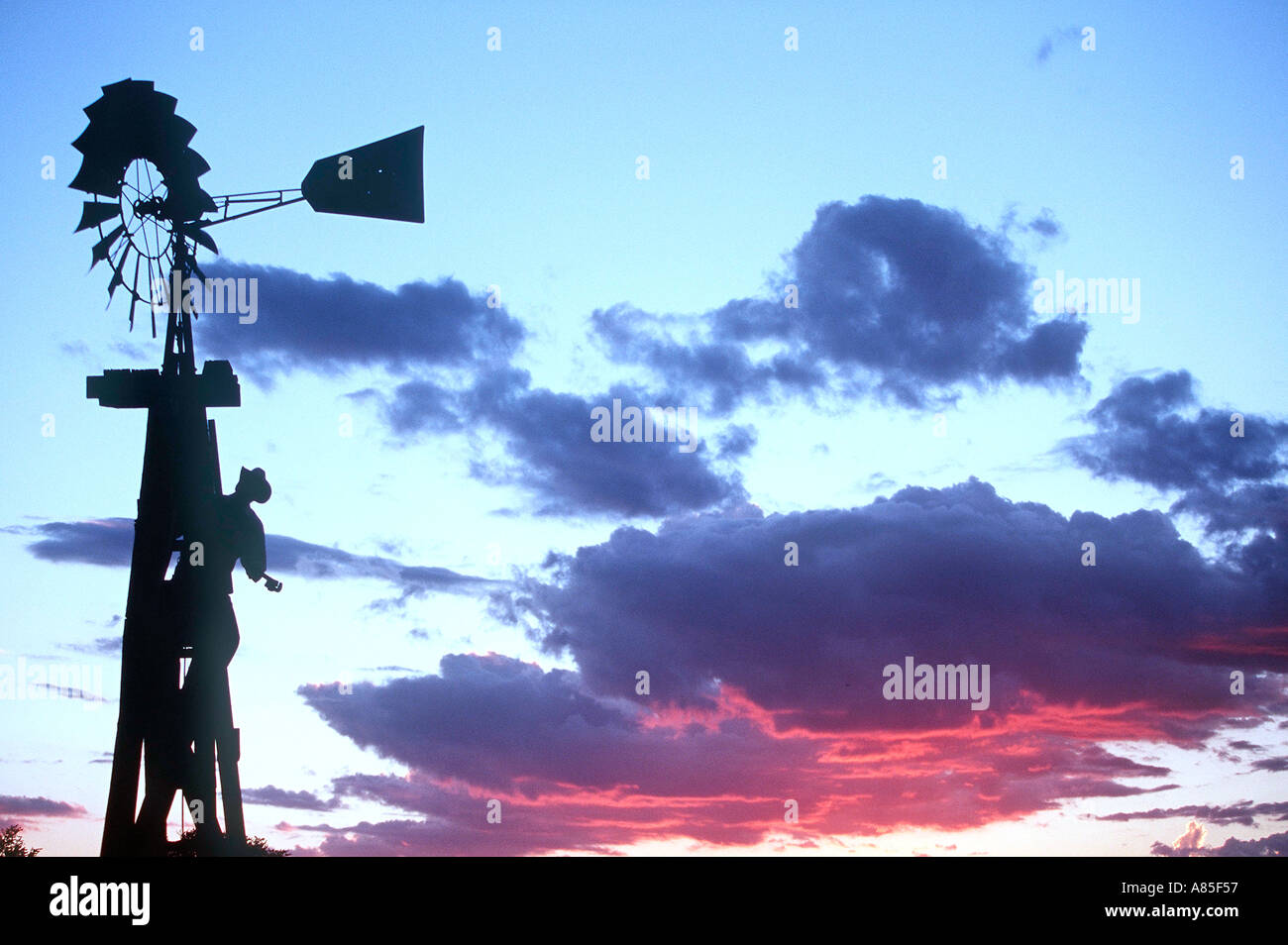 Cowboy on windmill hi-res stock photography and images - Alamy