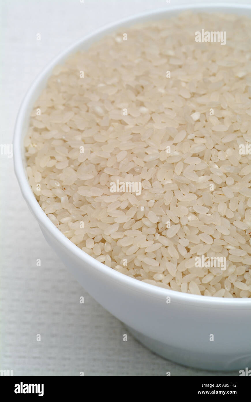 Bowl filled uncooked rice hi-res stock photography and images - Alamy