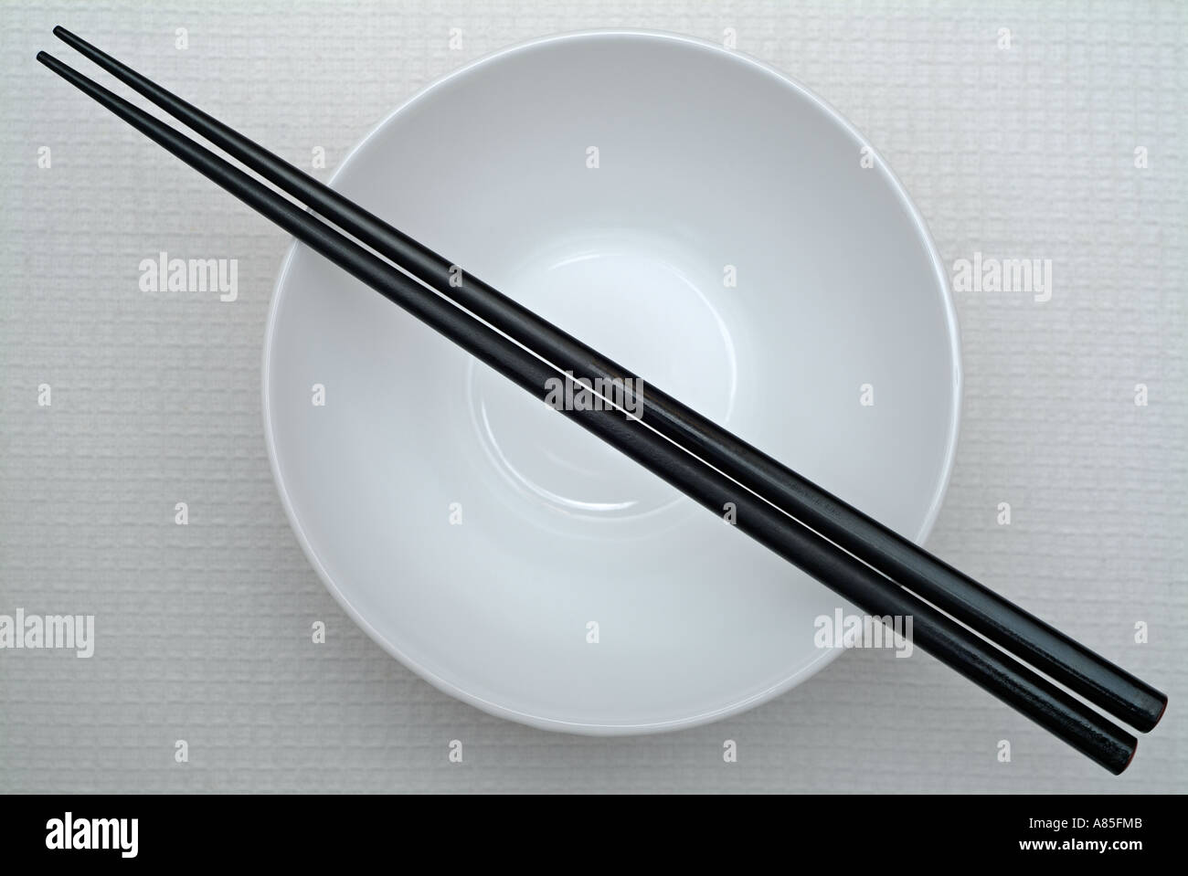 Empty White Rice Bowl With Chopsticks Stock Photo - Alamy
