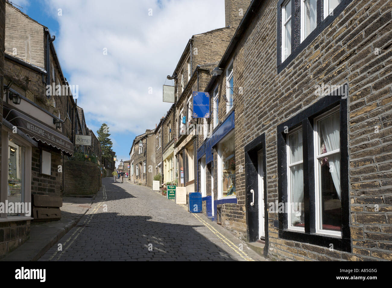 Hilly cobbled main street haworth hi-res stock photography and images ...