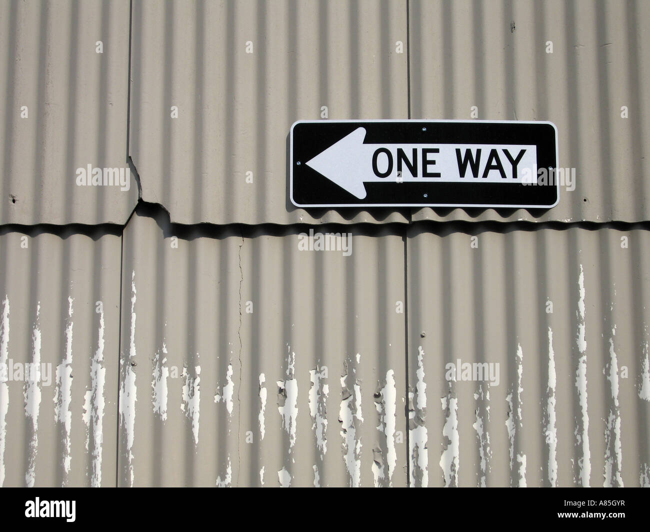 One way sign on corrugated metal, New York America USA Stock Photo - Alamy
