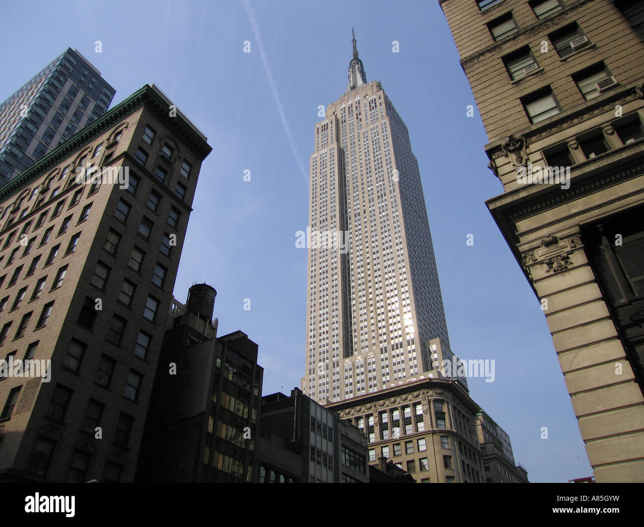 Empire State Building office framed by surrounding buildings New York ...