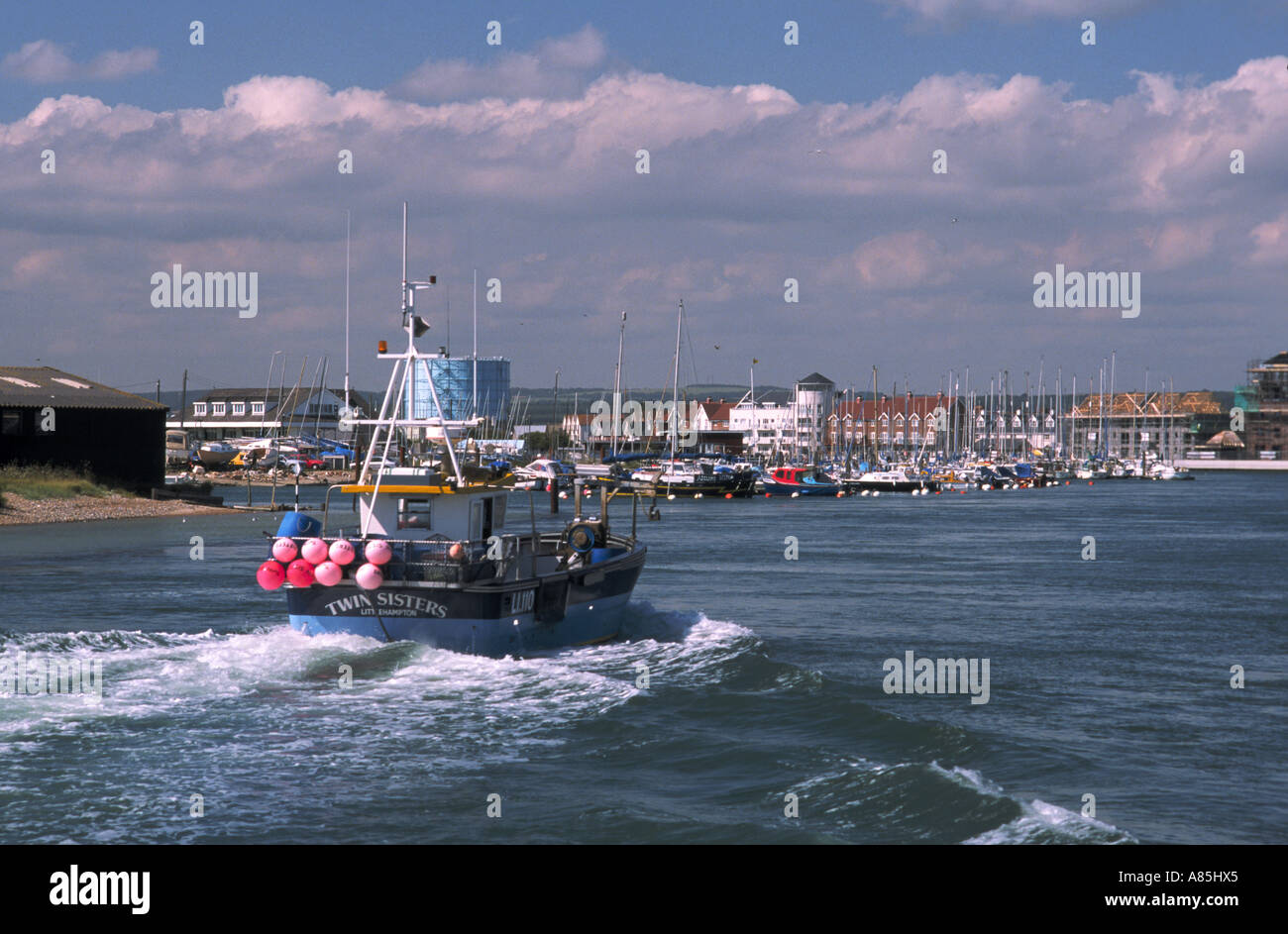 Colourful Fishing Boat entering the fast flowing River Arun, at ...