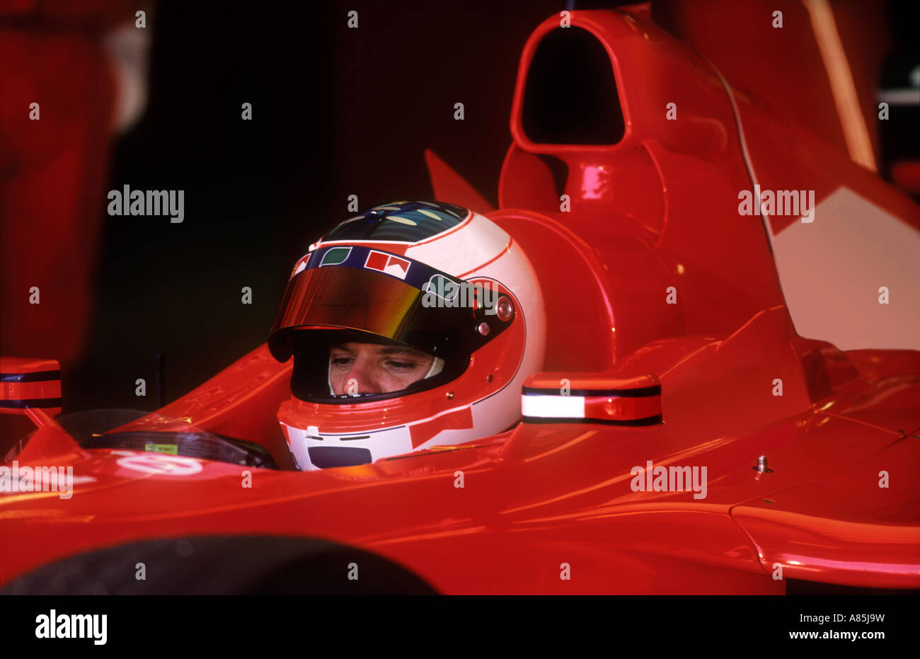 PROFESSIONAL SPORTS DRIVER SITTING IN A FORMULA ONE RACING CAR Stock ...