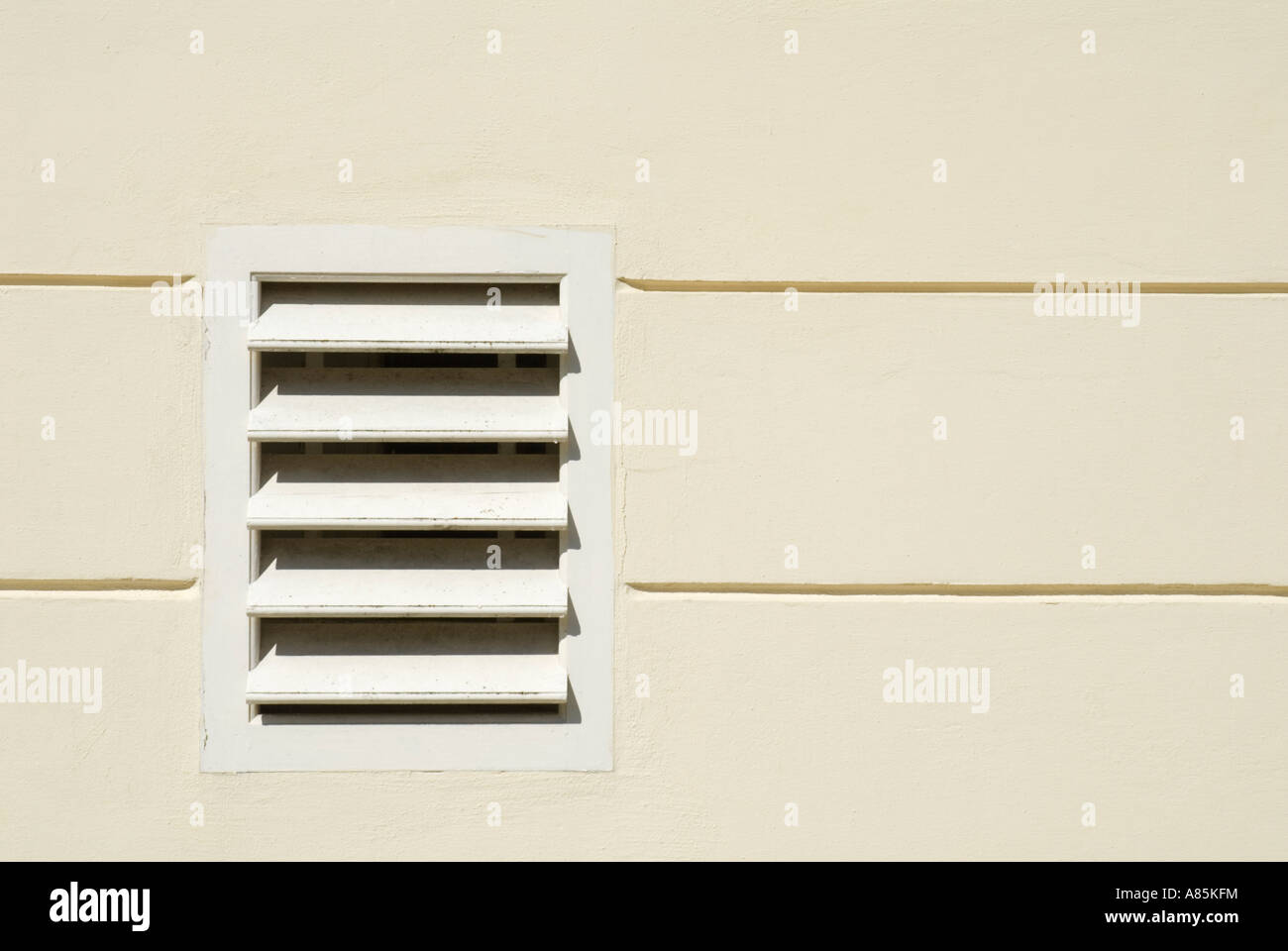 Air Vent Louvered cream wall Stock Photo - Alamy