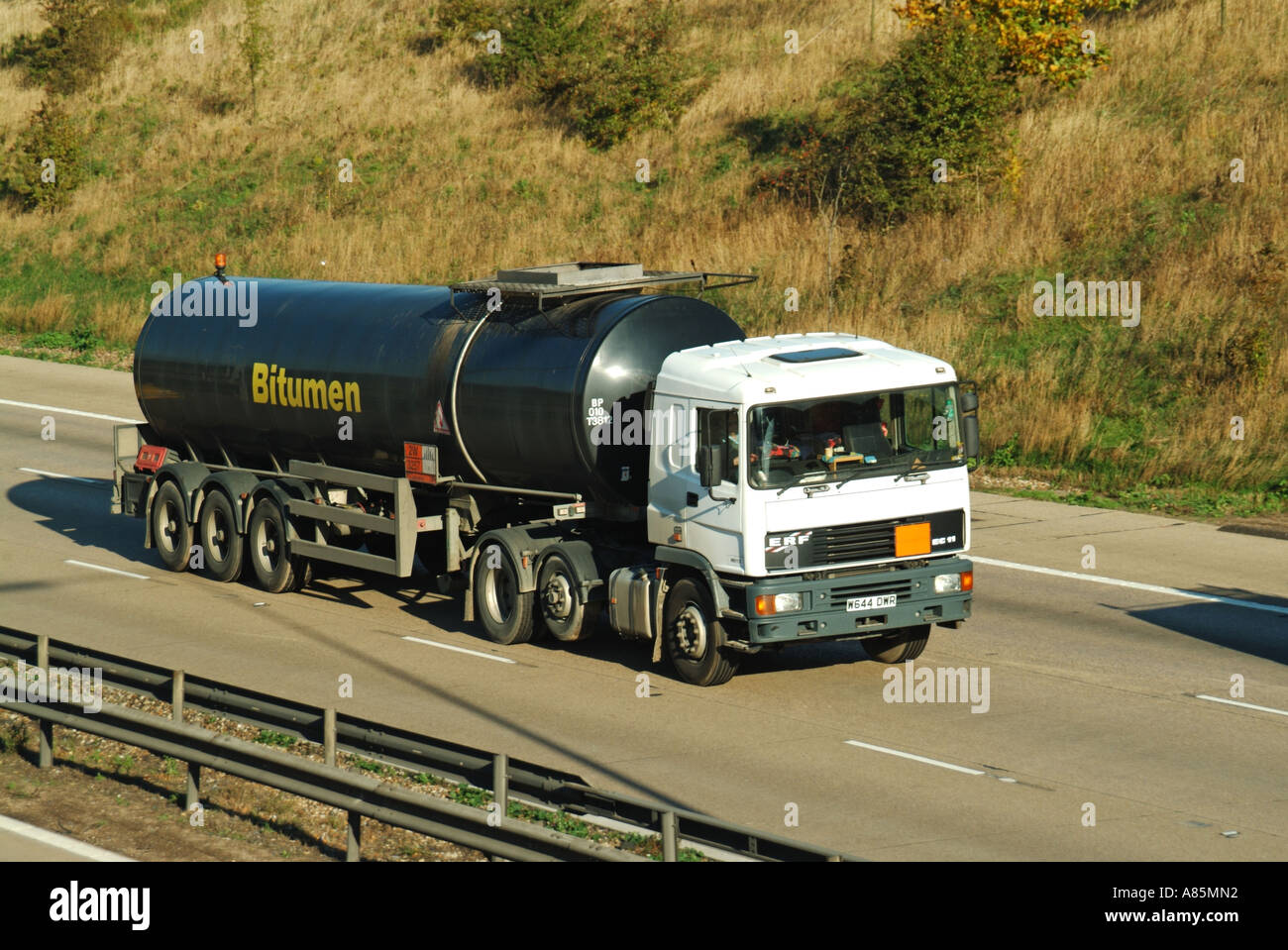 M25 motorway Bitumen tanker ERF lorry with raised tyre saving wheels ...