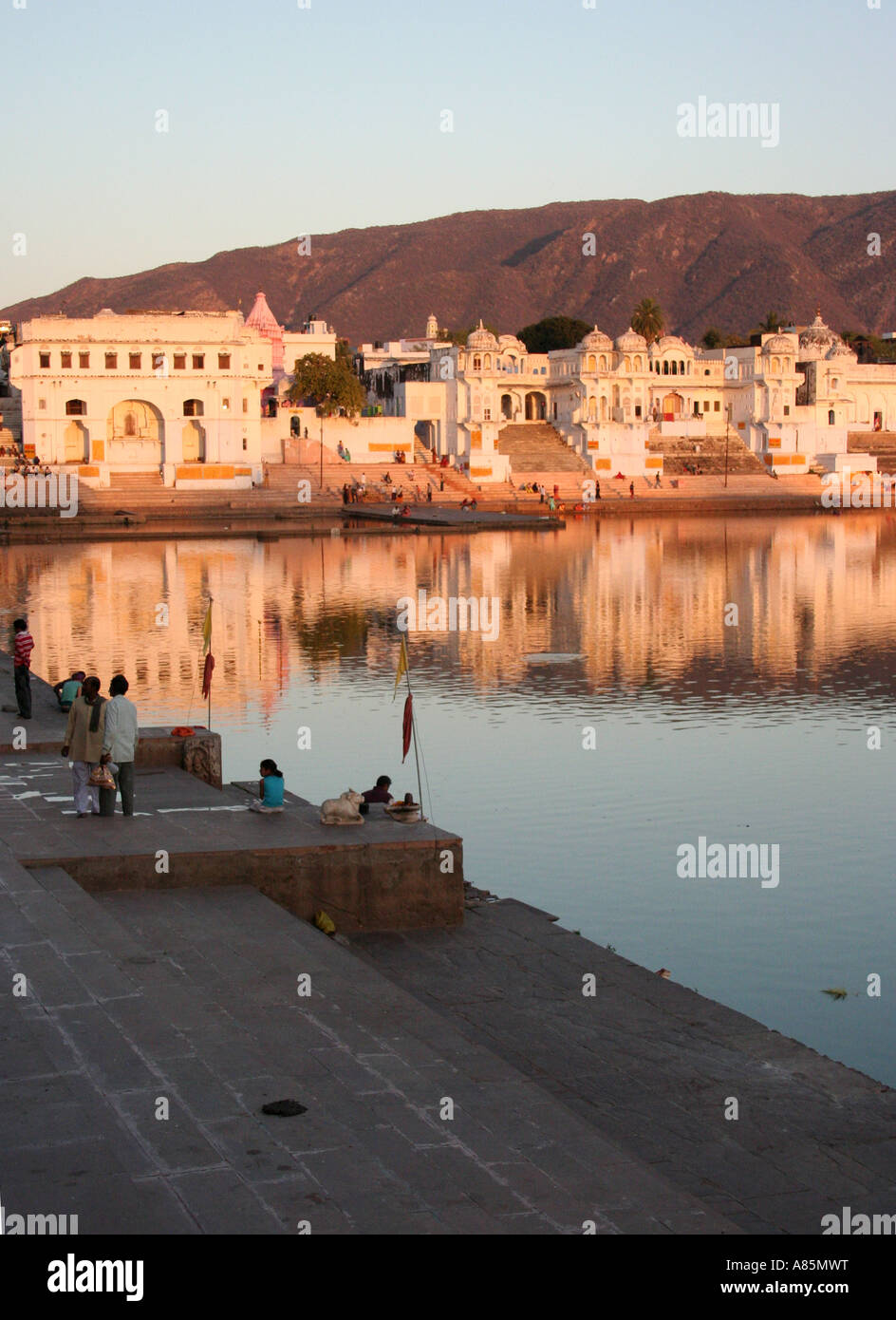 People on a bathing ghat on the banks of Pushkar lake, Pushkar ...