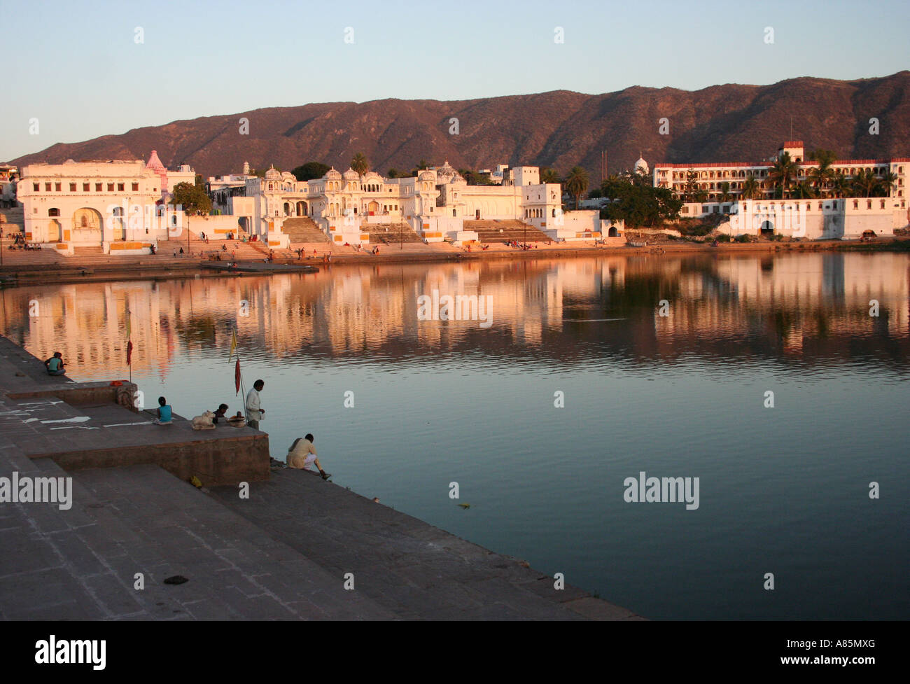 People on a bathing ghat on the banks of Pushkar lake, Pushkar ...