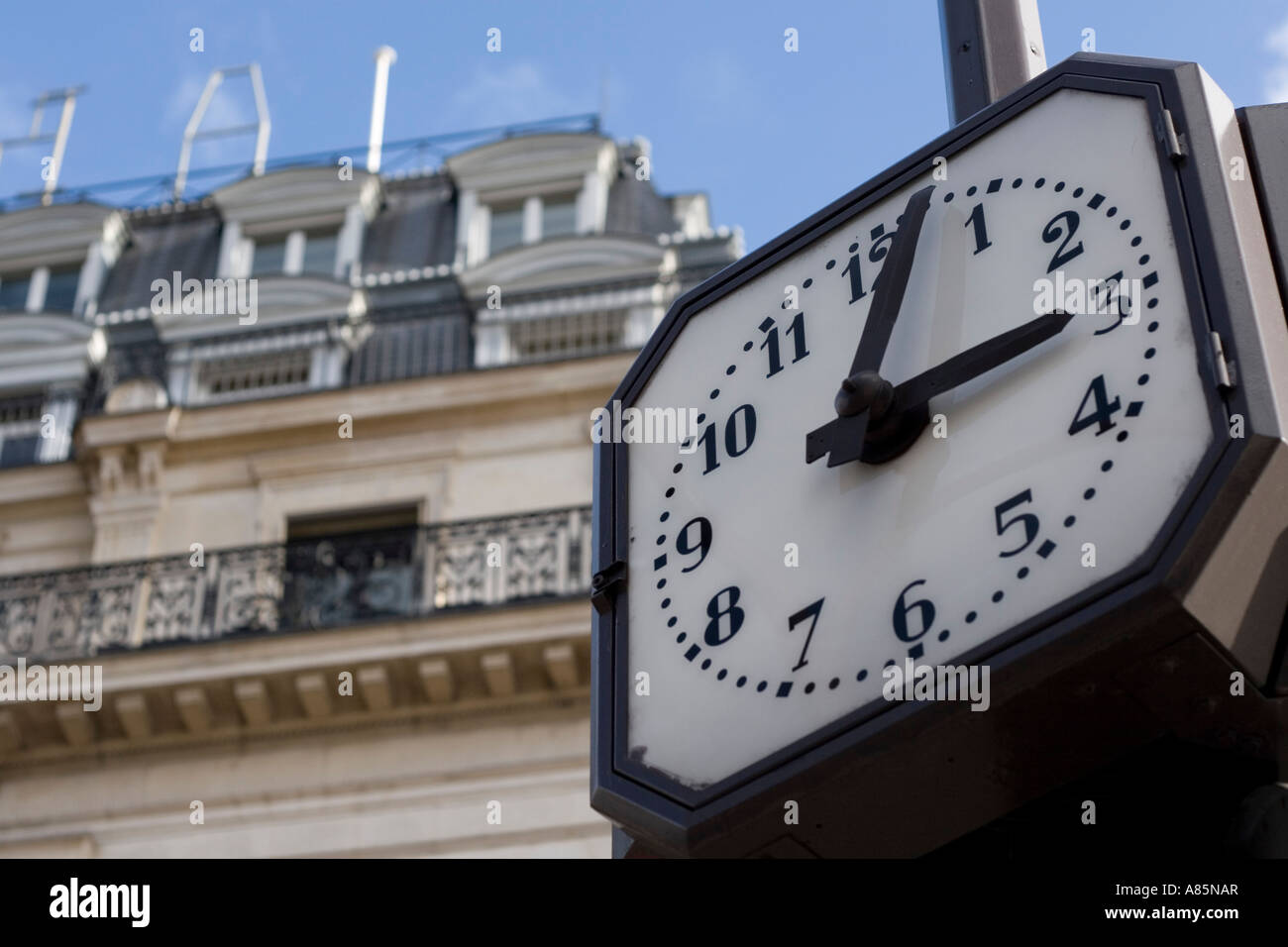 Clock in a Parisian street Stock Photo - Alamy
