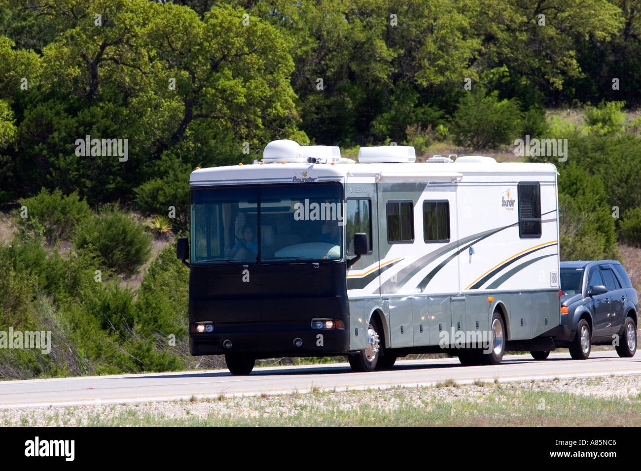 A recreational vehicle pulling a car on Interstate 10 in west Texas ...