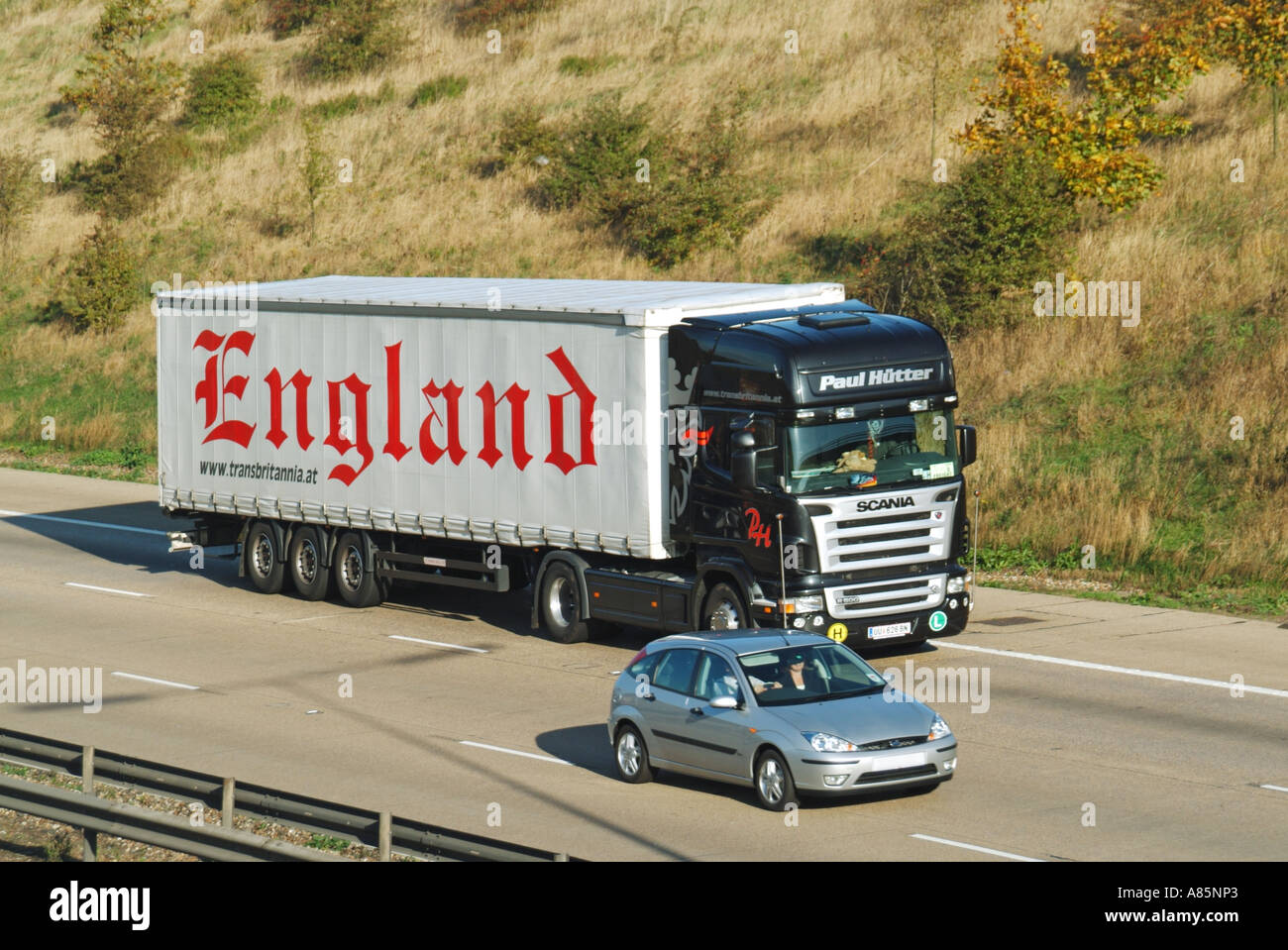 M25 motorway articulated lorry England slogan car overtaking Stock ...