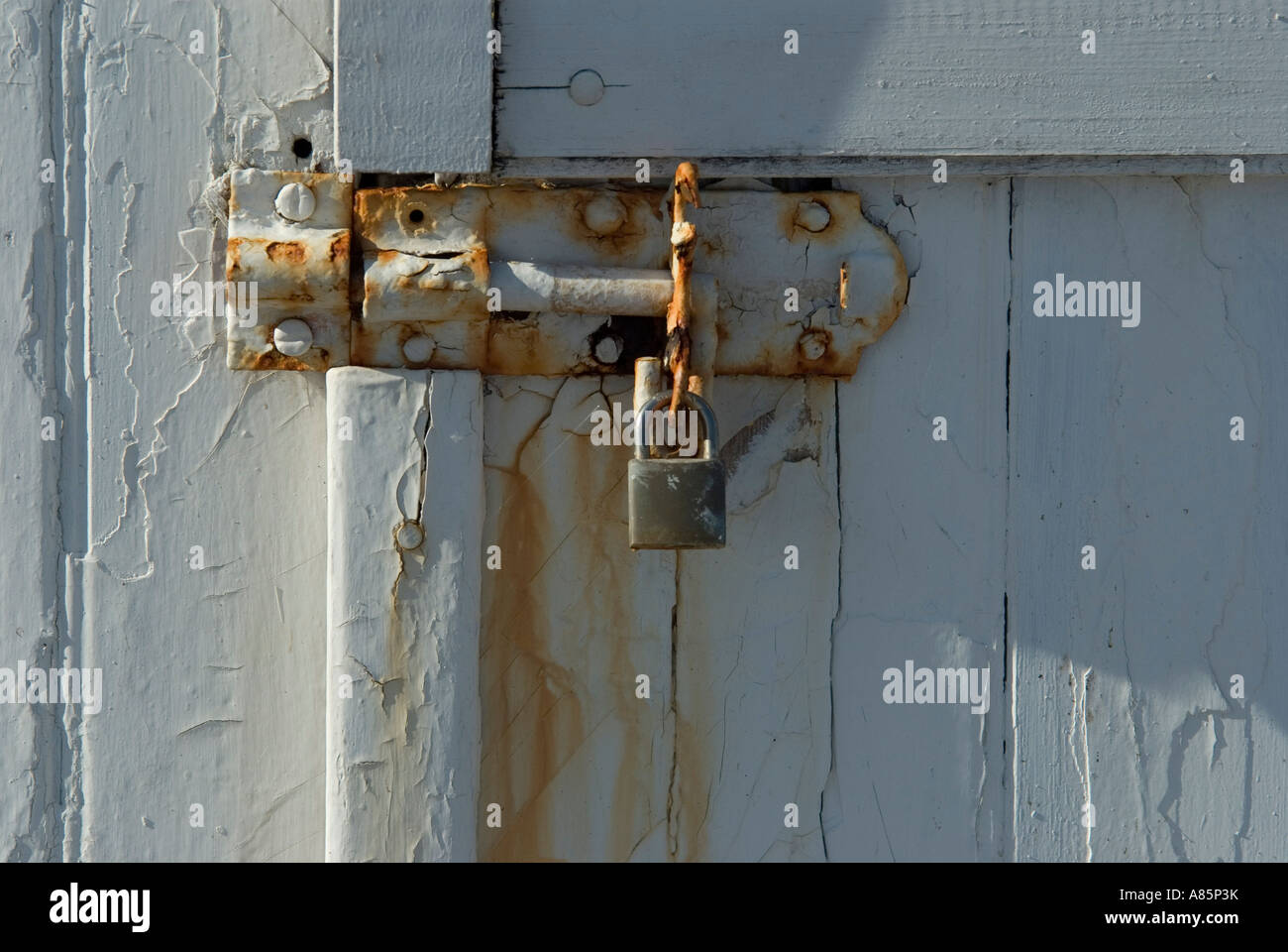 Rusty lock, beach hut, Axemouth Devon Stock Photo - Alamy