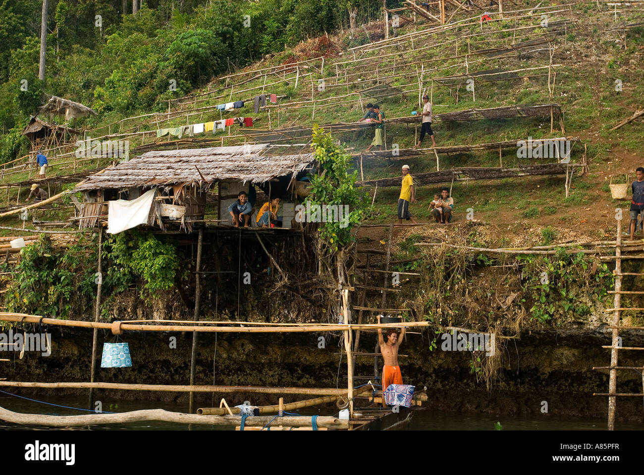 Butonese fishermen in Kabui Bay and temporary fishing village they set ...