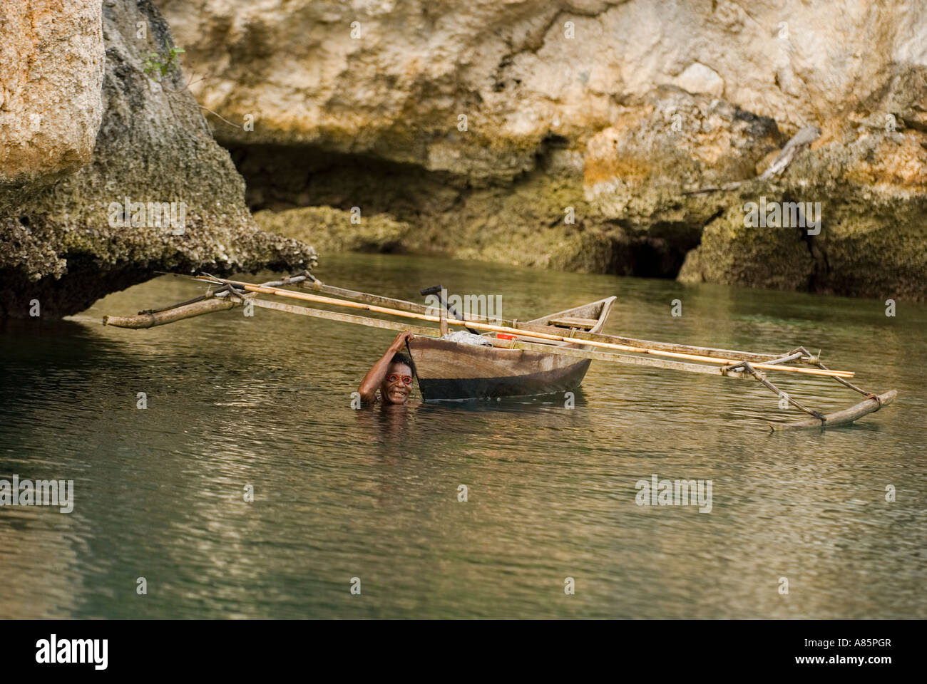 Local fisherman collecting sea cucumber trepang in Kabui Bay, Waigeo ...