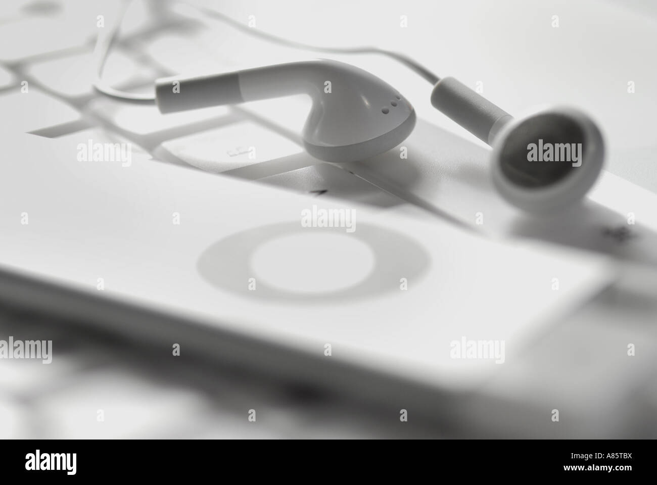 ipod mp3 player on laptop keyboard Stock Photo - Alamy