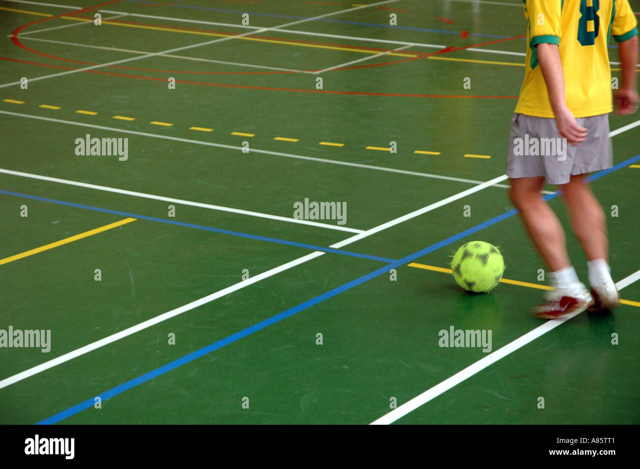 Football on gym hall Stock Photo - Alamy