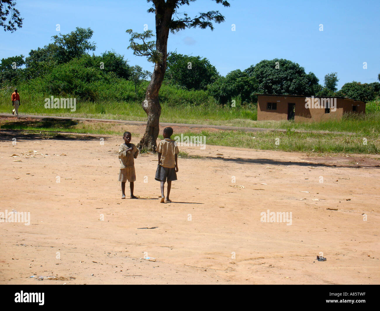 Typical scene in small rural village with local people along the road ...