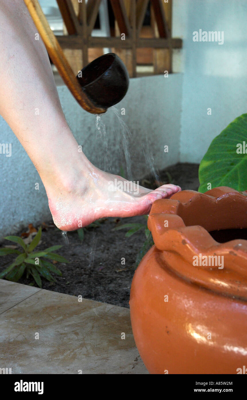 Washing sandy feet hi-res stock photography and images - Alamy