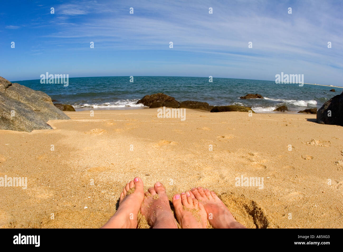Couple intertwining feet on beach Punta Colorada Baja Mexico Stock ...