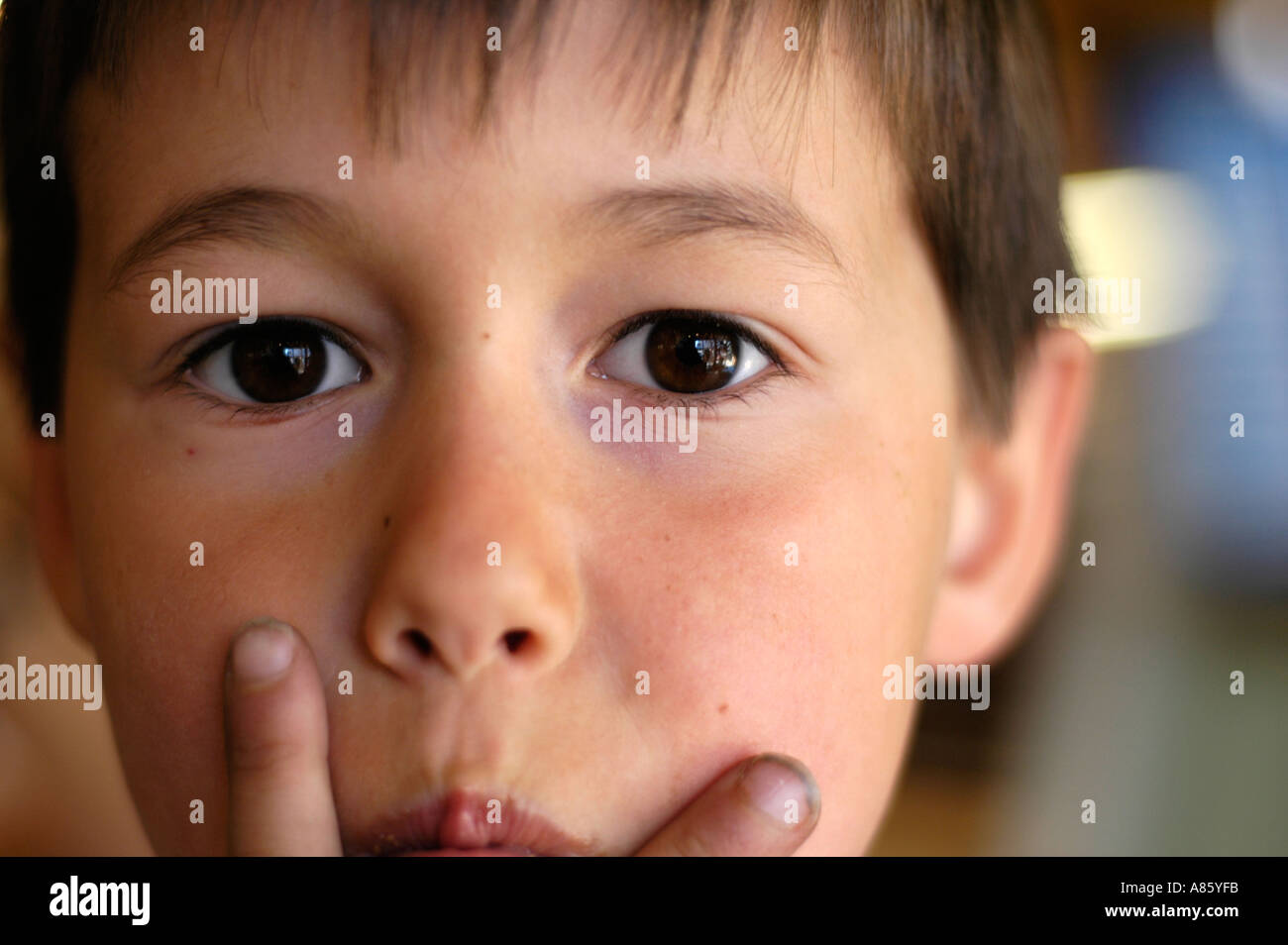 Young boy caucasian about eight making faces Stock Photo - Alamy
