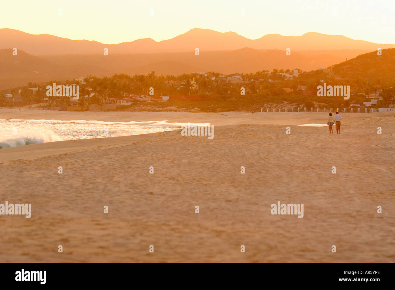 Couple walking on beach Cabo San Lucas Mexico Stock Photo - Alamy