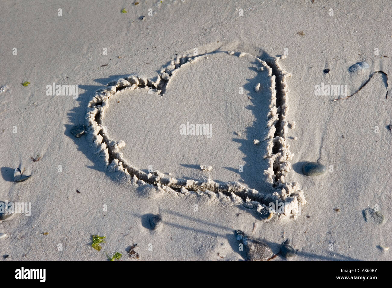 HEART SHAPE PAINTED IN THE SAND ON THE BEACH Stock Photo - Alamy