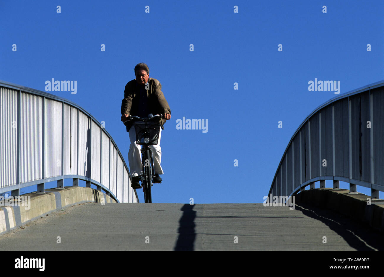 Cyclist on a cycle path in Cologne, North Rhine Westphalia, Germany ...