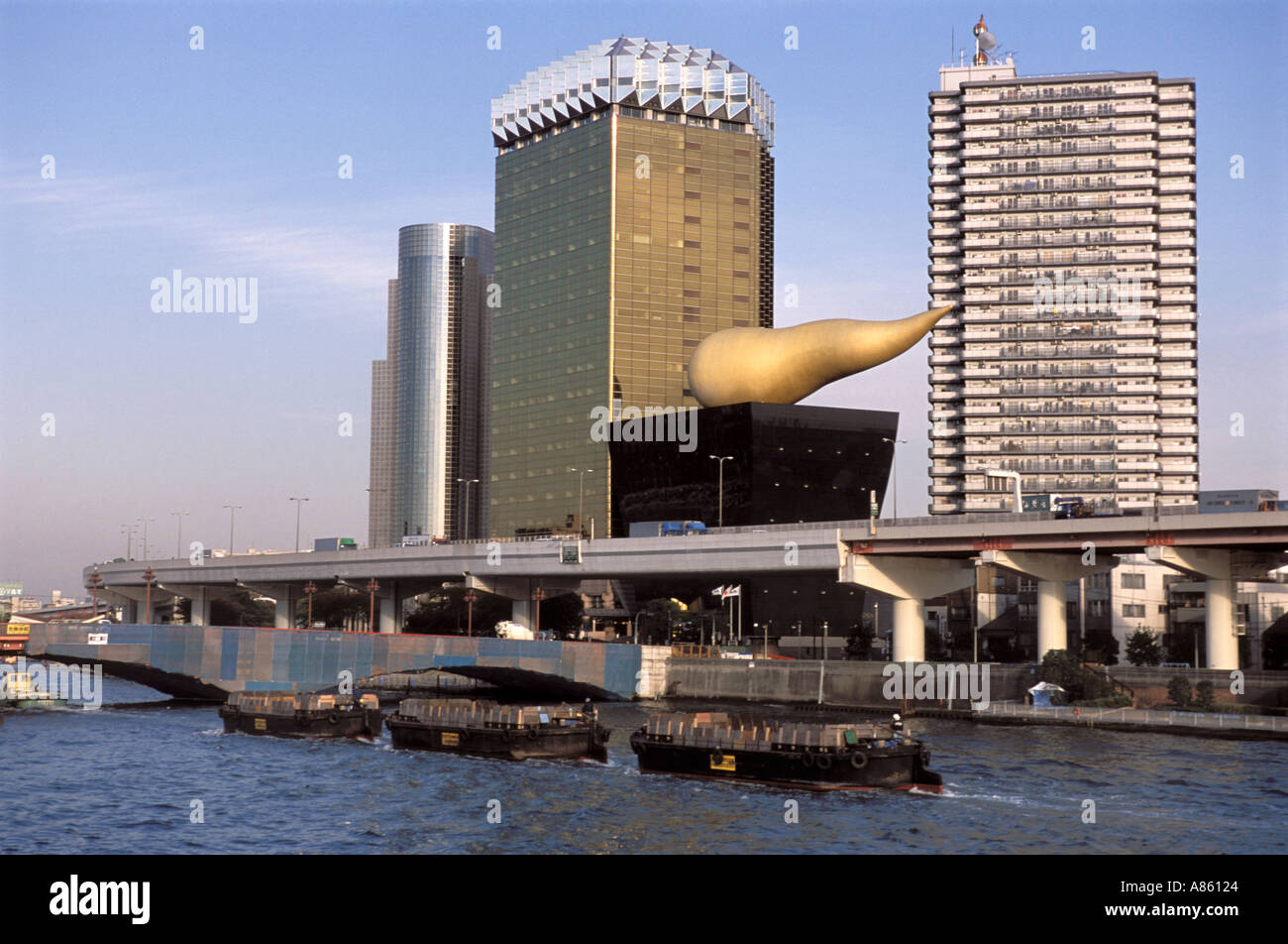 The gold flame atop Asakusa Tokyo's Asahi Beer Building beside the ...