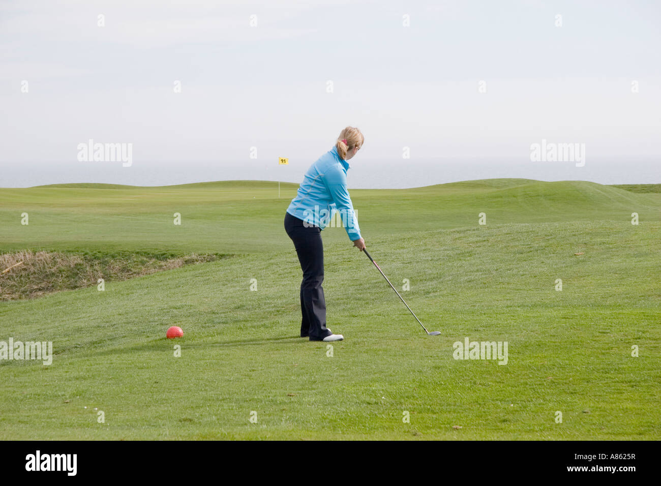 Par 3 on golf course - view from tee off to putting green Stock Photo ...