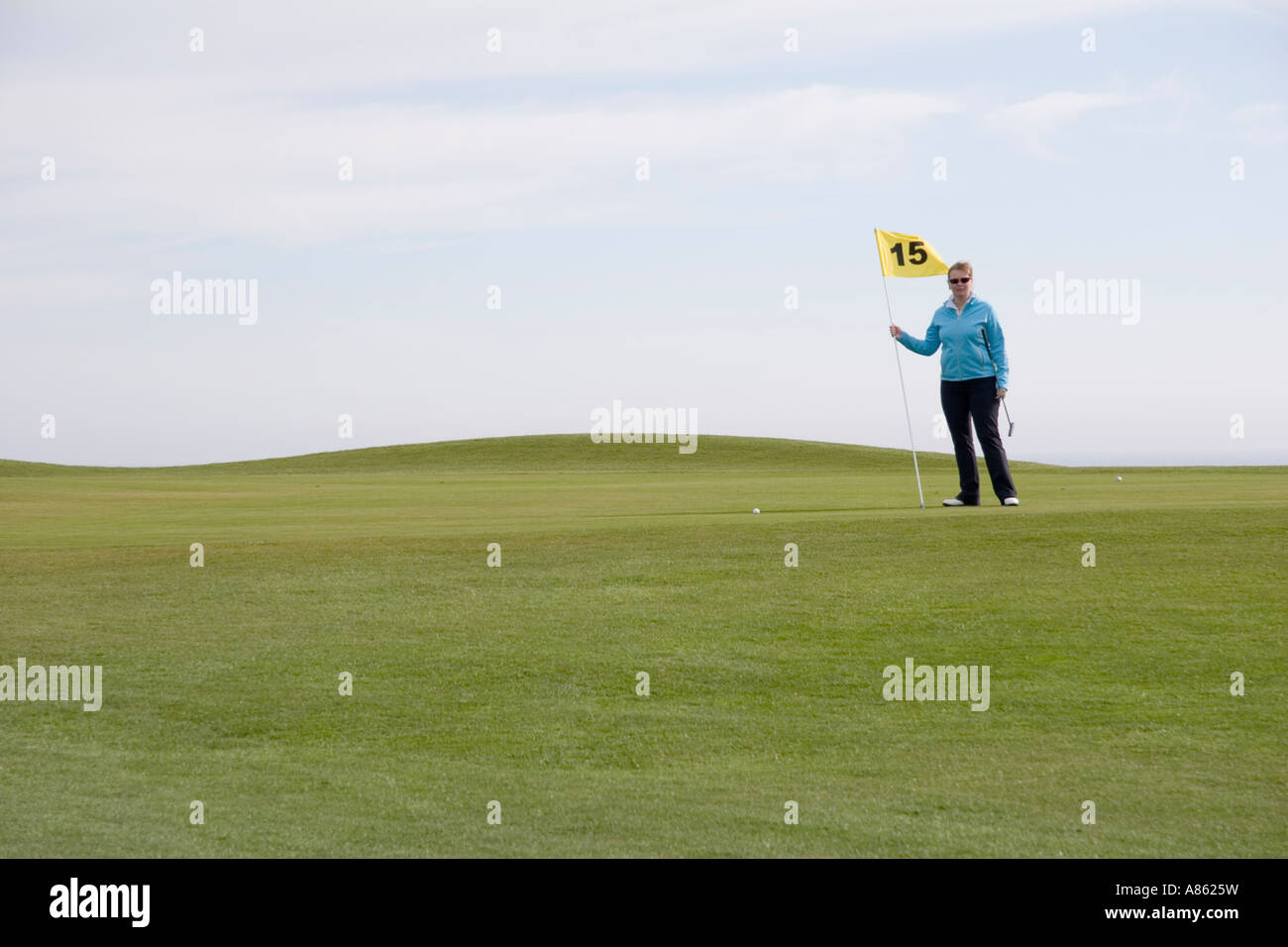 Par 3 on golf course - view from tee off to putting green Stock Photo ...