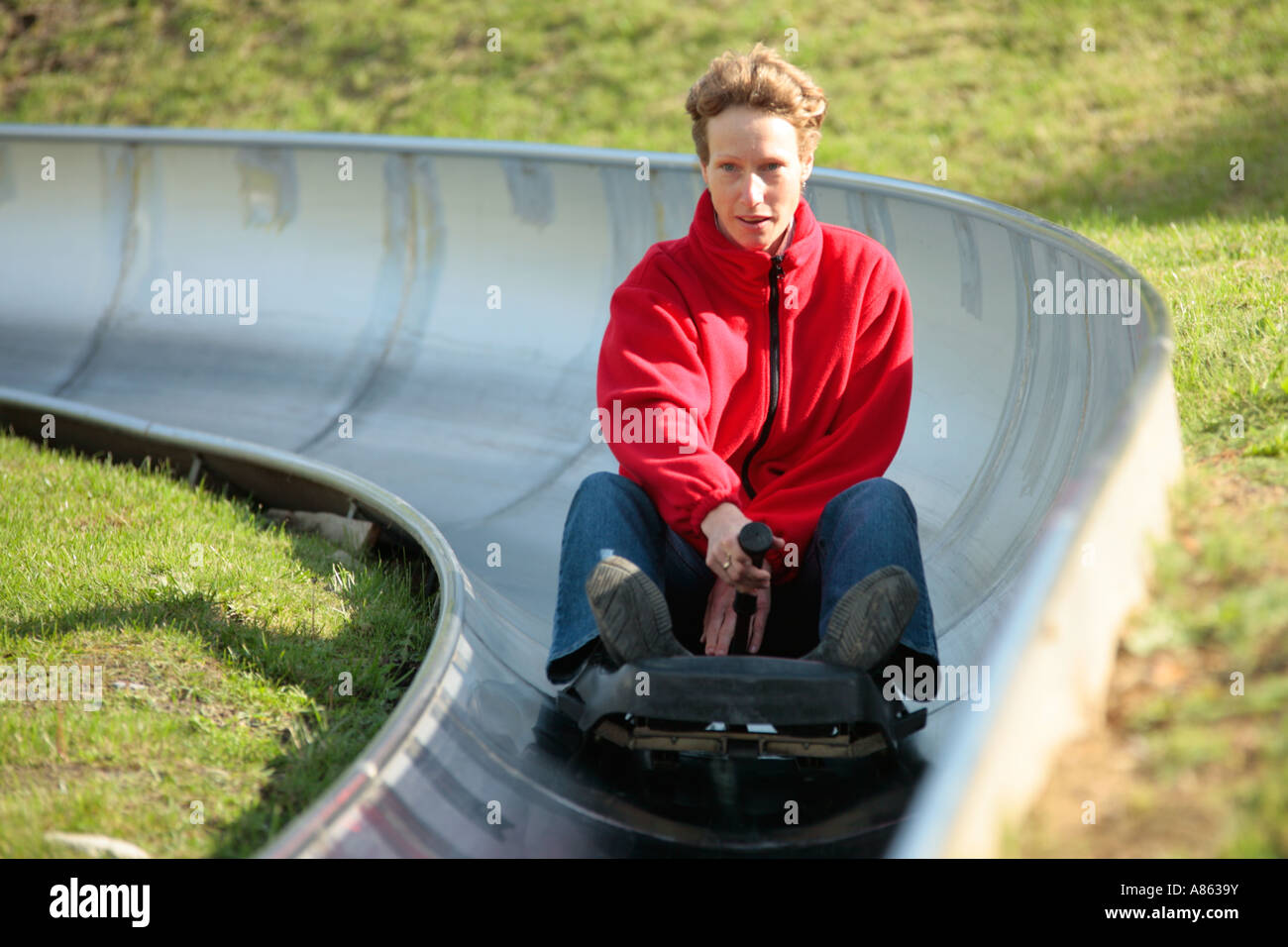 young woman on a dry luge run Stock Photo - Alamy