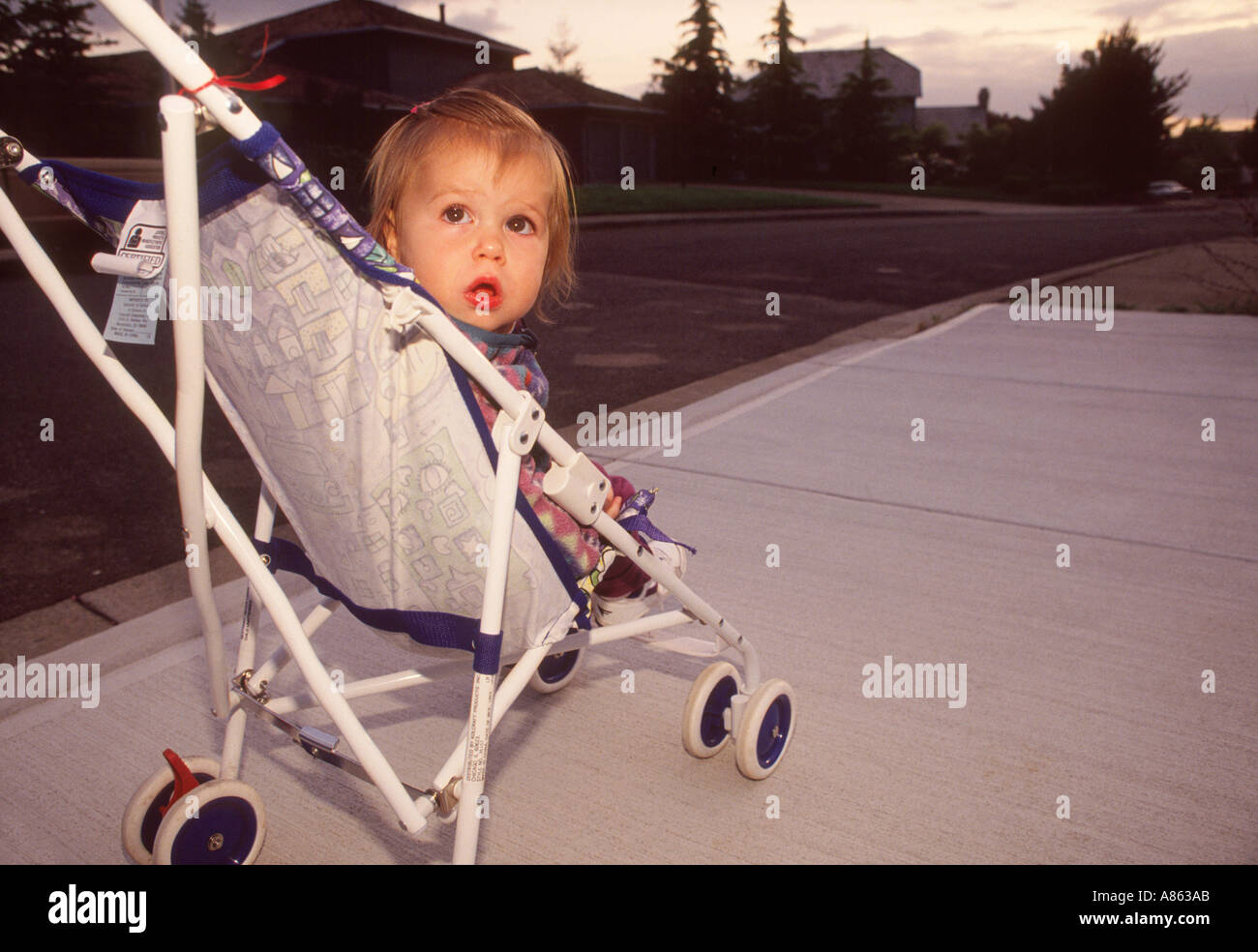Baby in stroller Stock Photo - Alamy
