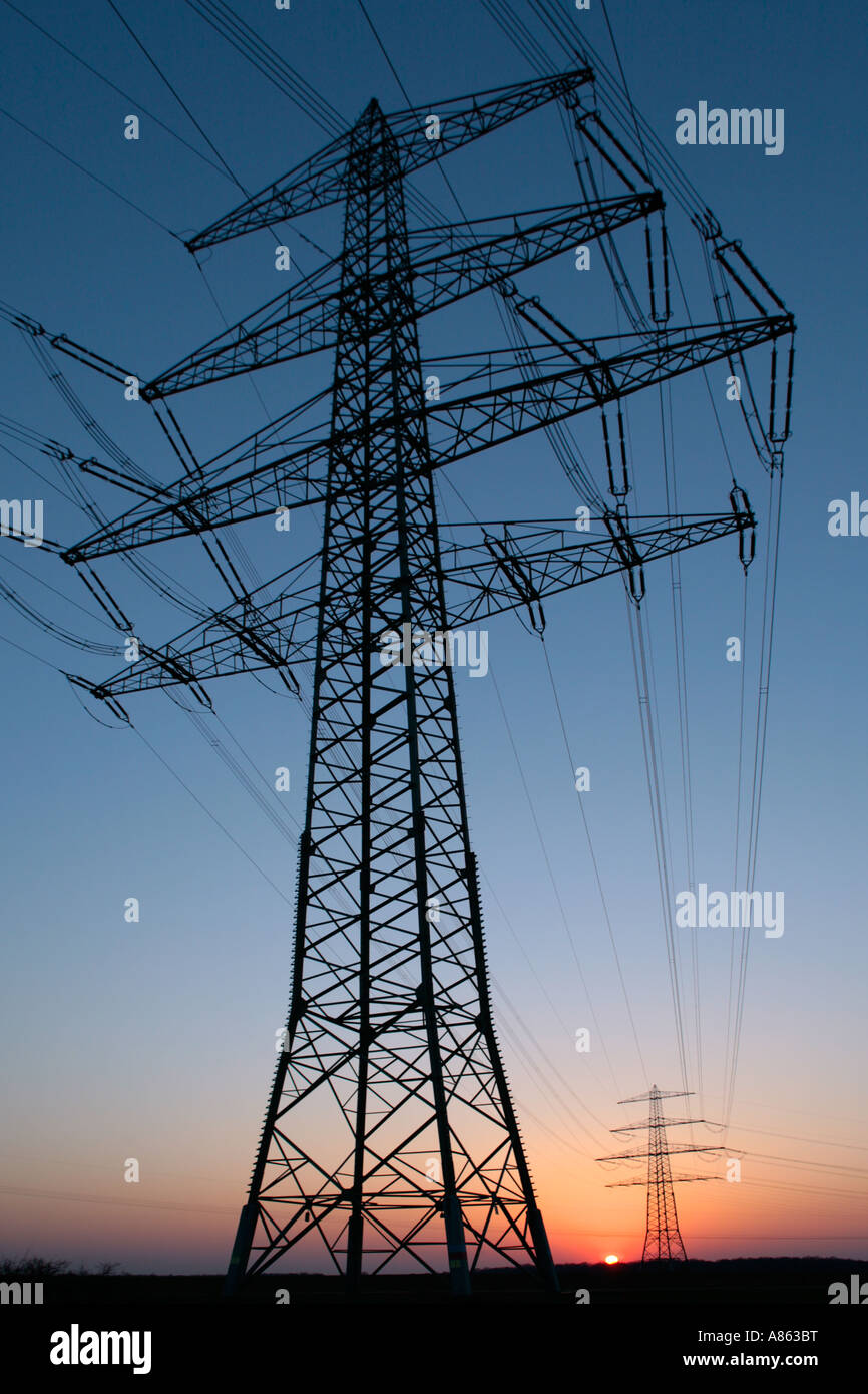 pylons in front of the setting sun Stock Photo - Alamy