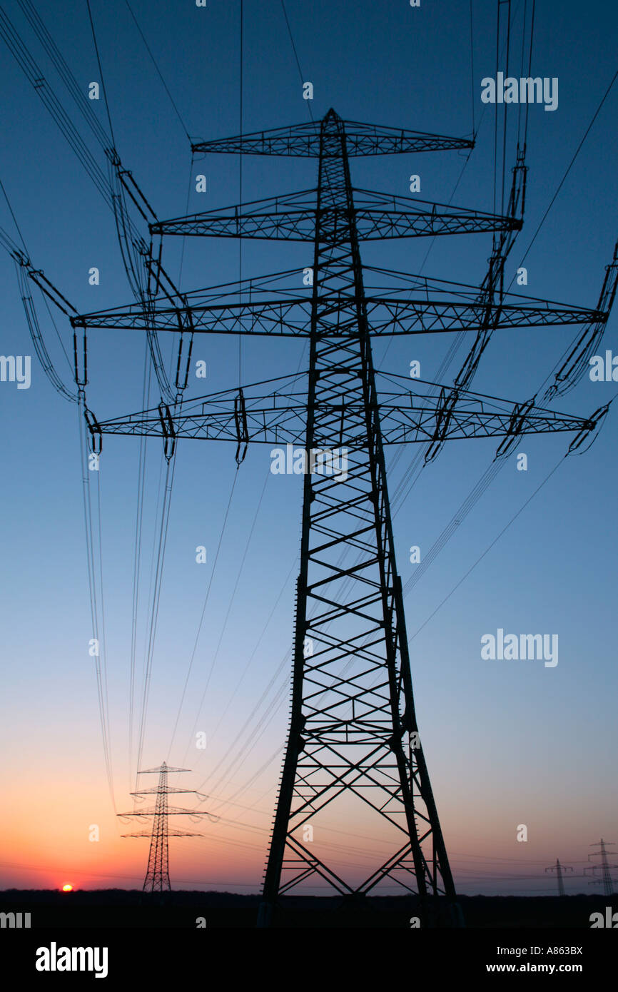 pylons in front of the setting sun Stock Photo - Alamy