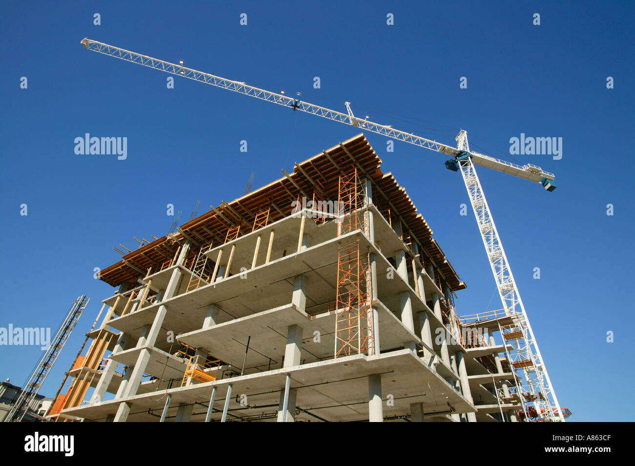Construction crane over building Stock Photo - Alamy