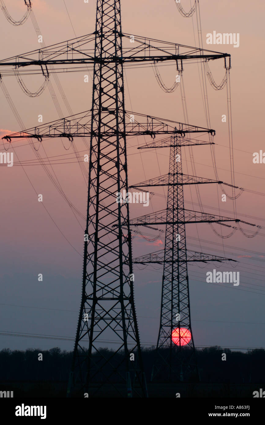 pylons in front of the setting sun Stock Photo - Alamy