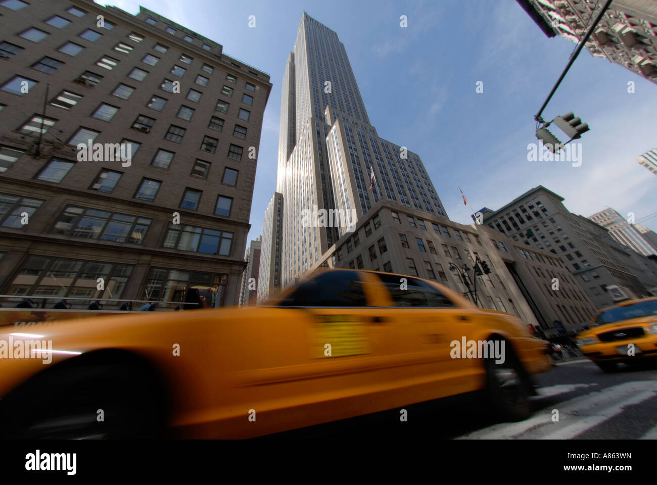 New York Cab with Empire State Building in background Stock Photo - Alamy